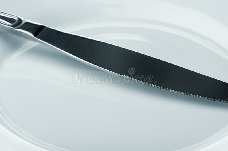 Kinife on a plate stock image. Image of metal, objects - 10593733