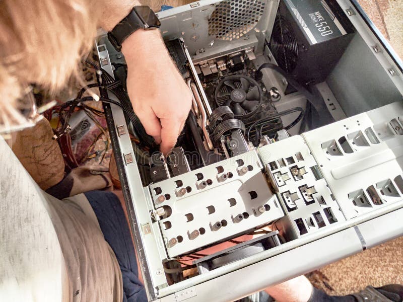 Kirov, Russia - March 23, 2025: Computer Assembly in a Home Workspace during Daylight with ...