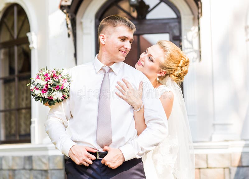 Kiss the bride and groom stock photo. Image of bride - 70241114