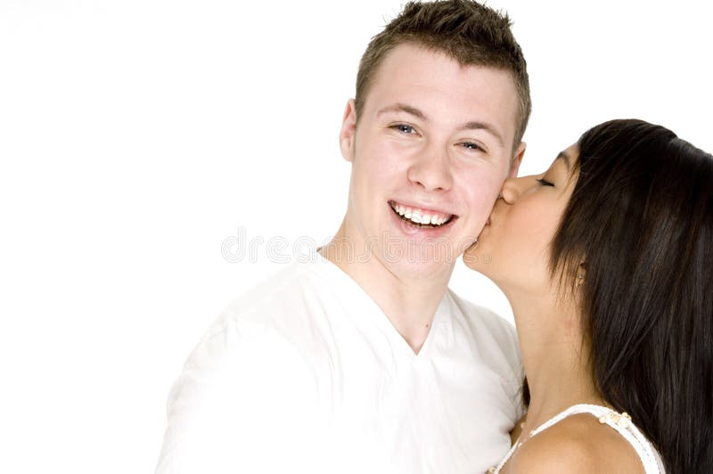 Kiss On The Cheek stock photo. Image of teenagers, young - 1113186
