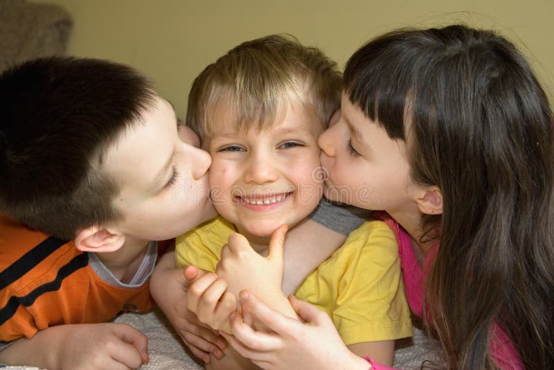 Kiss on the cheek stock image. Image of hugging, joking - 2053971