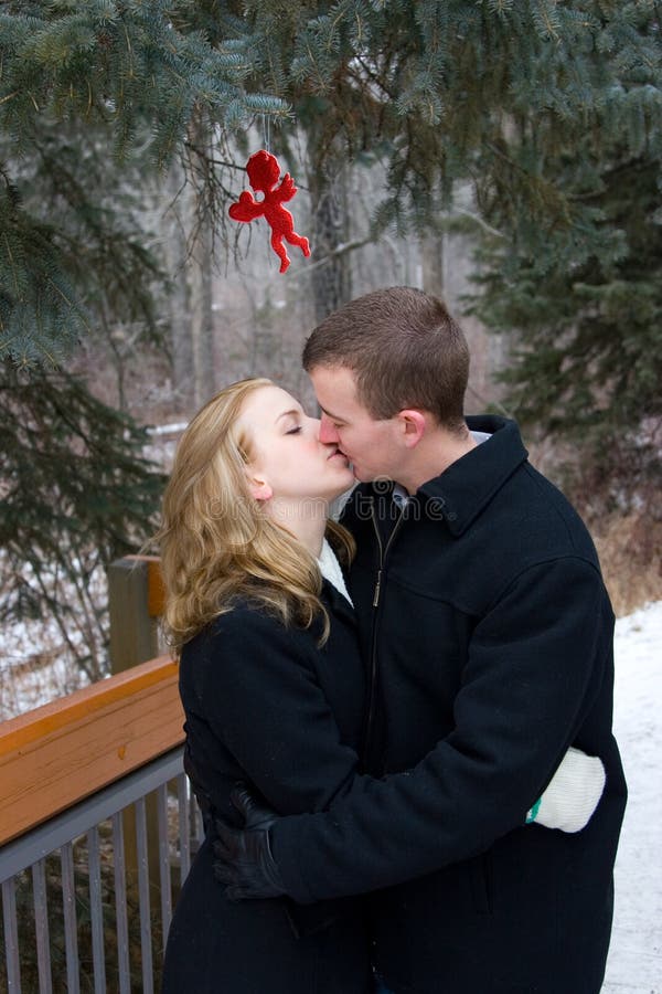 Kiss for Cupid stock photo. Image of handsome, cool, people - 452040