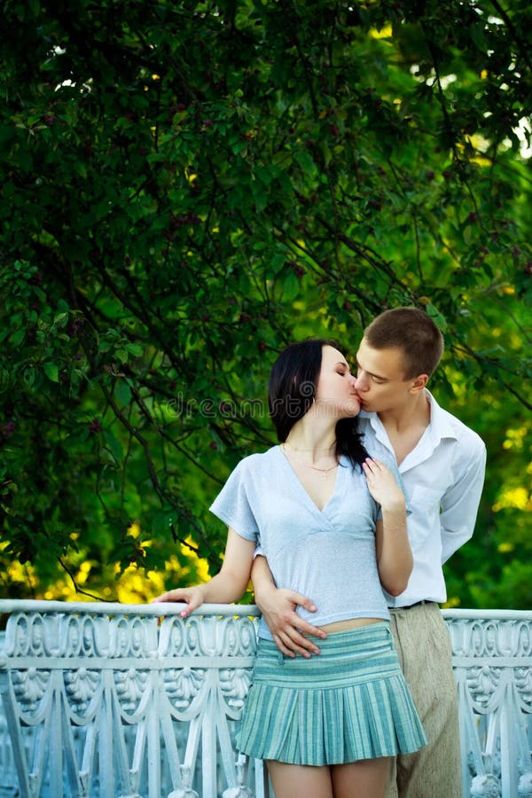 Kissing couple in the park stock image. Image of happy - 15553215