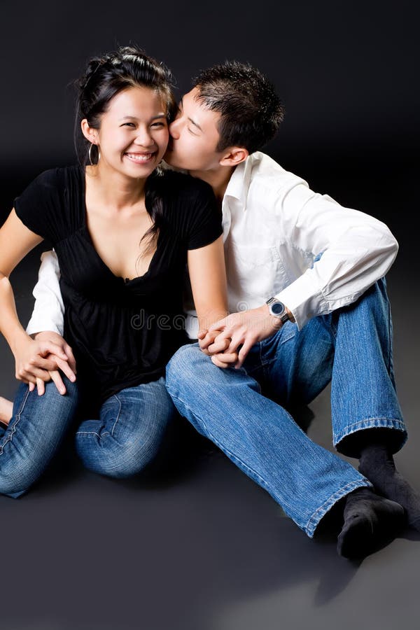 Kissing on her cheek stock image. Image of sensual, chinese - 5178167