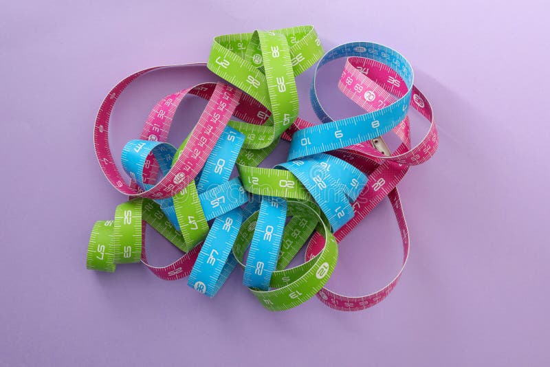 Kit of Different Measuring Tapes on Purple Background, Flat Lay Stock ...