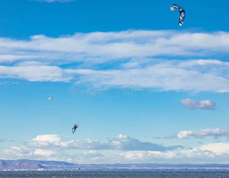 Kit Surfer Taking Off in the Wind Against the Blue Sky Stock Photo ...