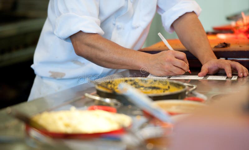 Chef Preparing Fish in Restaurant or Hotel Kitchen Stock Photo - Image ...