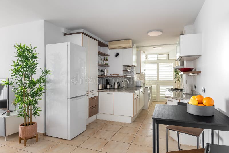Kitchen Area Adjacent with Living Area in Smart Apartment Stock ...