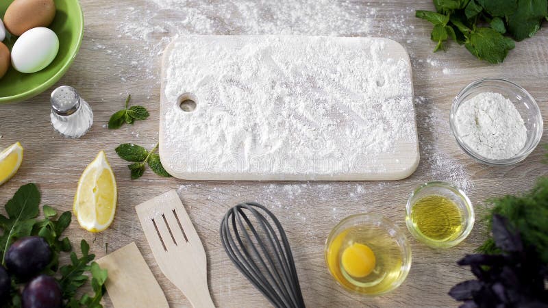 Kitchen Board with Baking Flour on the Table and Pastry Ingredients ...