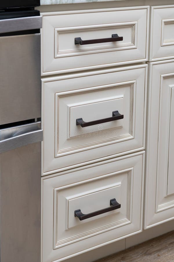 Kitchen cabinet handles stock image. Image of clean - 308621321