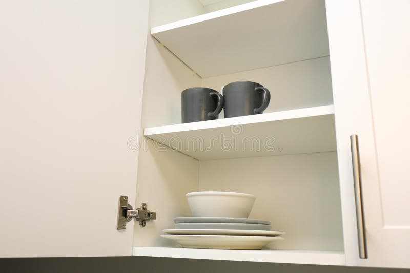 Kitchen Cabinet with Plates and Dishes on the Shelf Stock Image - Image ...