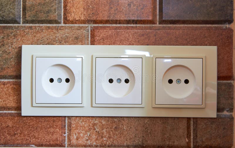Socket is Triple,in the Kitchen on a Ceramic Tile Triple Electrical ...