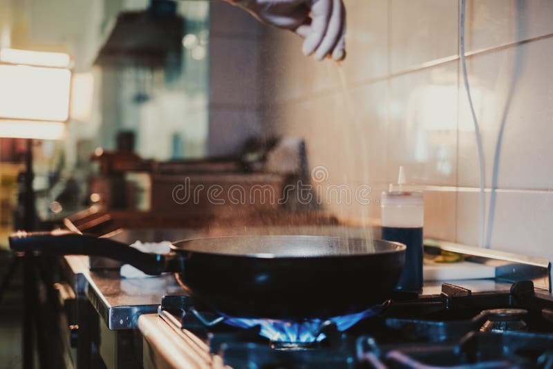 Kitchen Chef Adding Salt in Frying Pan Stock Photo - Image of fresh ...