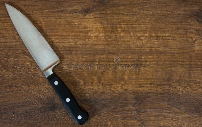 Kitchen Chef Knife on the Brown Wooden Table Background. with Copy ...