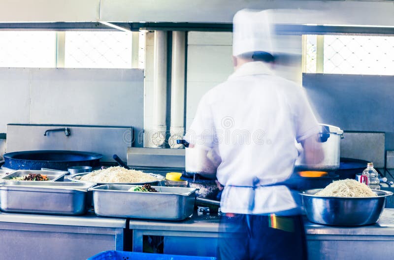Kitchen of a Chinese Restaurant Stock Photo - Image of blurred, chefs ...