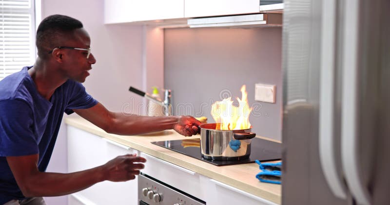 Kitchen Cooking Mistake and Fire Disaster Stock Photo - Image of ...