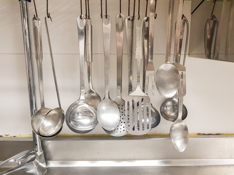 Kitchen Cooking Utensils on Steel Rack Stock Photo - Image of spatula ...