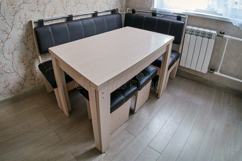 Kitchen Corner with a Table with a Sofa and Stools. White Radiator ...