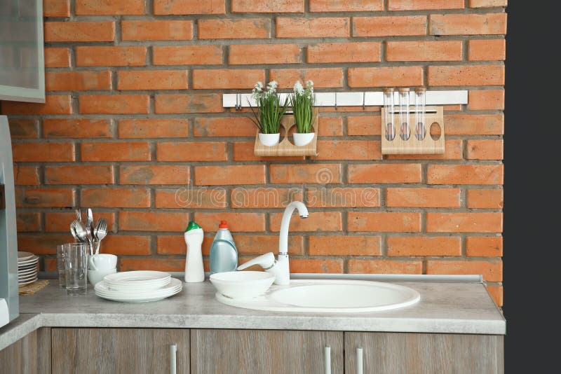 Kitchen Counter with Sink, Detergents and Clean Dishes Stock Photo ...