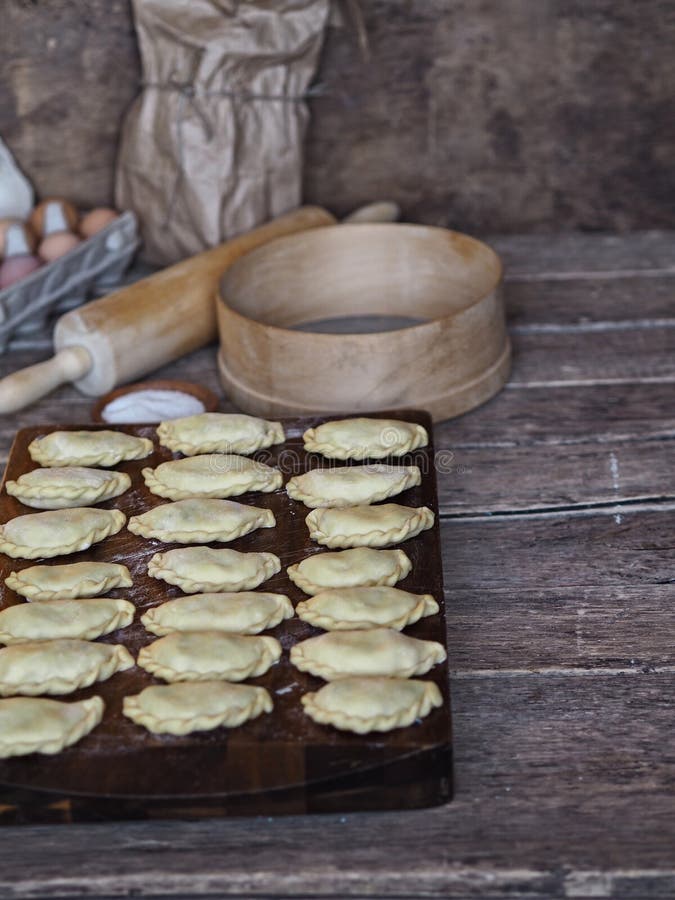 On the Kitchen Cutting Board, Ready-made Dumplings with Ingredients for ...