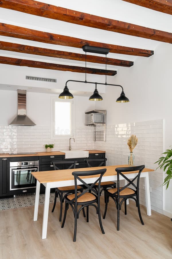 Kitchen and Dining Table with Chairs in Studio Apartment Stock Image ...