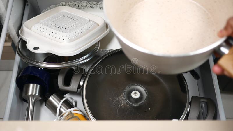 Kitchen Drawer Clutter with Various Cooking Utensils and Pots Stock ...