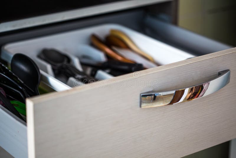 Kitchen Drawer Open with a Blurred Background. Stock Photo - Image of ...
