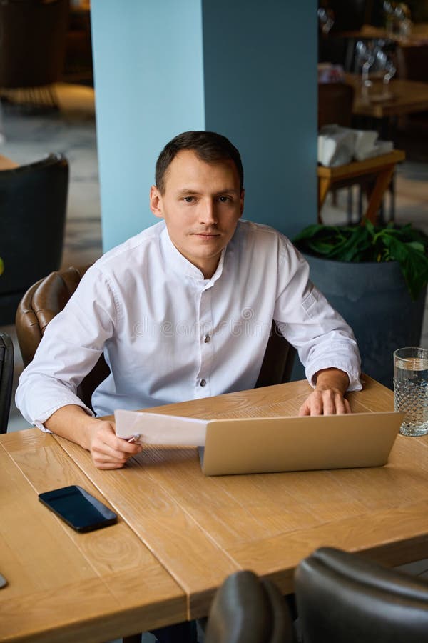 Kitchen Employee Works with Work Papers Stock Image - Image of works ...