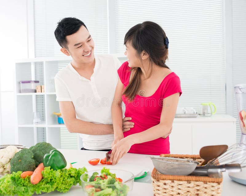 Asian couple in kitchen stock image. Image of couple - 36238761