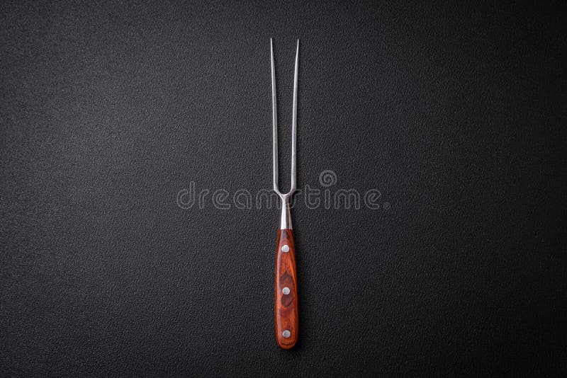 Kitchen Fork Made of Steel on a Dark Textured Background Stock Photo ...