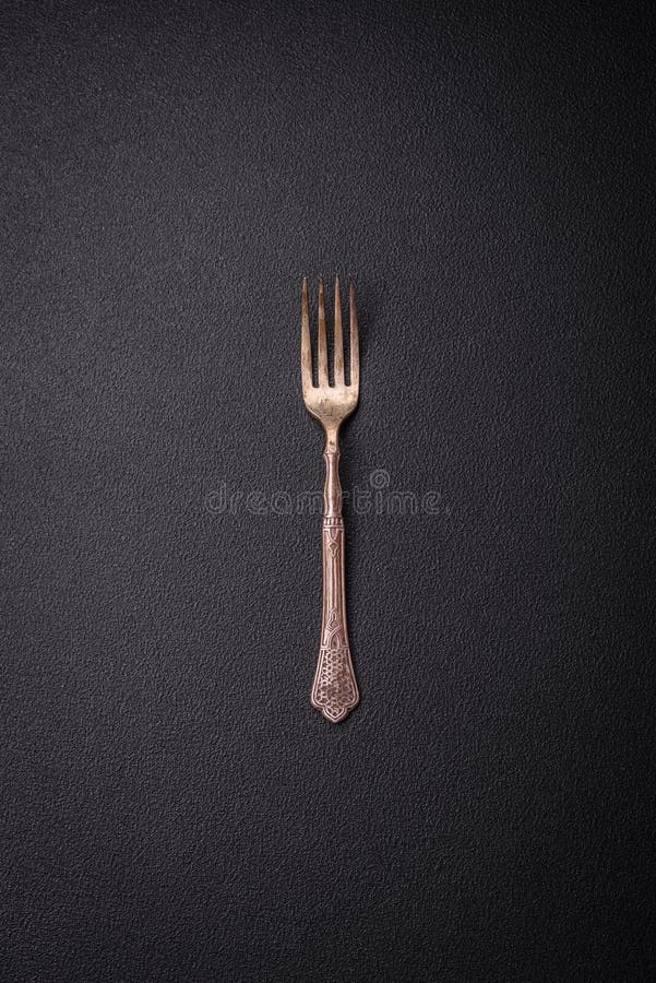 Kitchen Fork Made of Steel on a Dark Textured Background Stock Photo ...