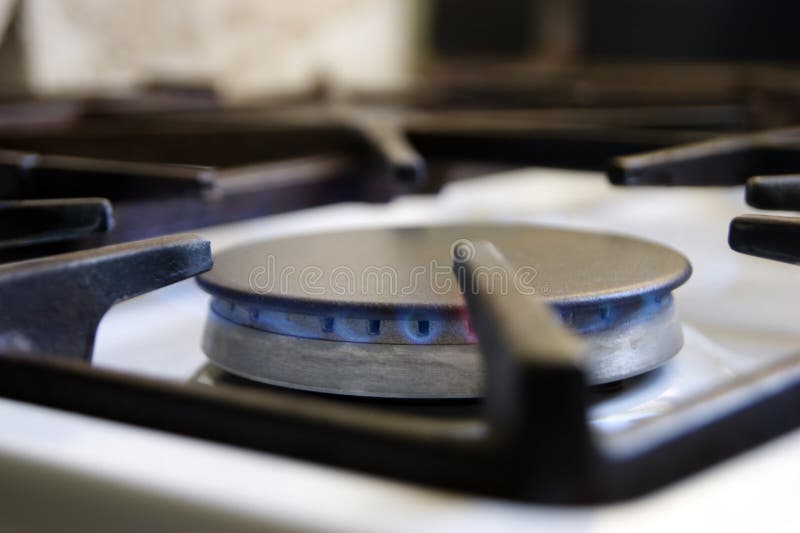 Kitchen Gas Stove with Low Burning Propane Gas. Stock Photo - Image of ...