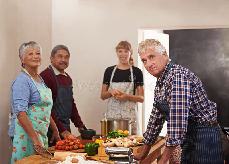 The Kitchen is a Gathering Place for Friends. a Group of People Cooking ...