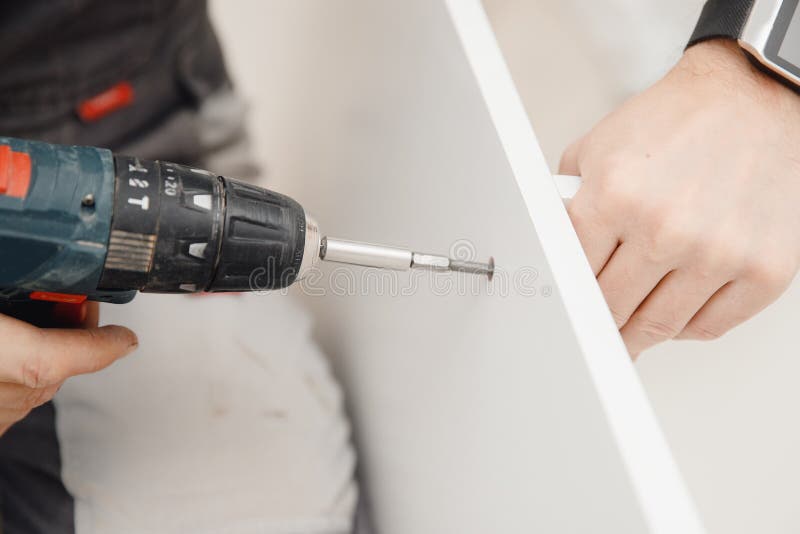 Kitchen Installation, Worker Tightens Bolts To Assemble Box from ...