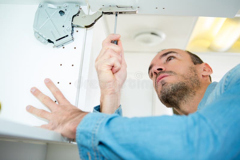 Kitchen Installer Doing Carpenter Work Stock Photo - Image of kitchen ...