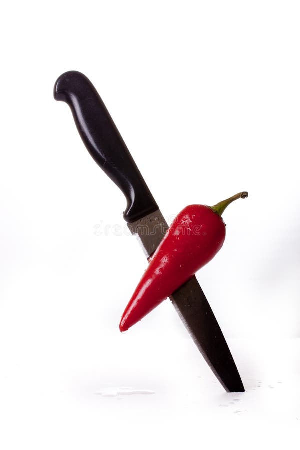 Kitchen Knife and Chilli stock photo. Image of white - 11969982