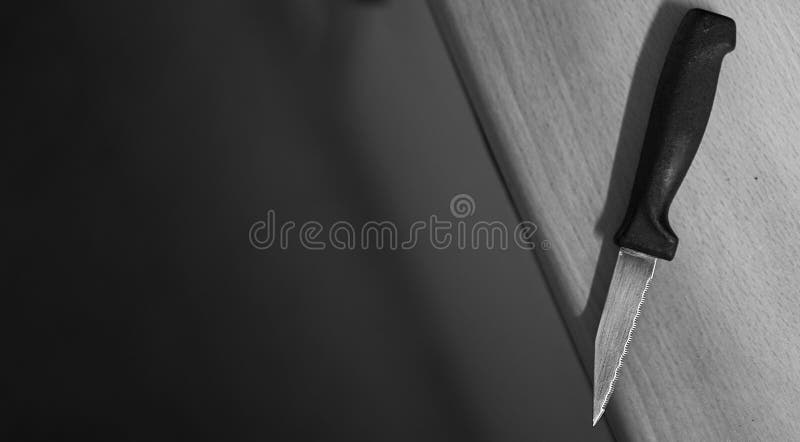 Kitchen Knife on the Edge of the Table in Black and White Stock Image ...