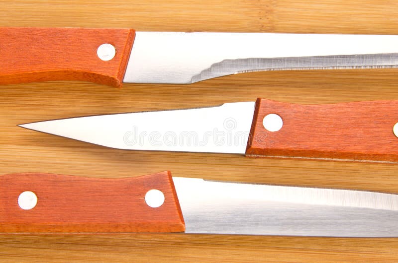 Kitchen Knives Over Wooden Board Stock Image - Image of board, handle ...