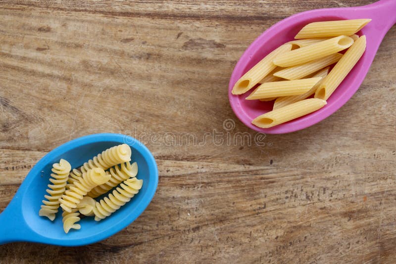 Kitchen Ladles with a Variety of Pasta on Top Stock Image - Image of ...
