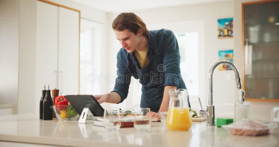 Kitchen, Learning or Man on Tablet for Cooking Recipe Method, Lunch or ...