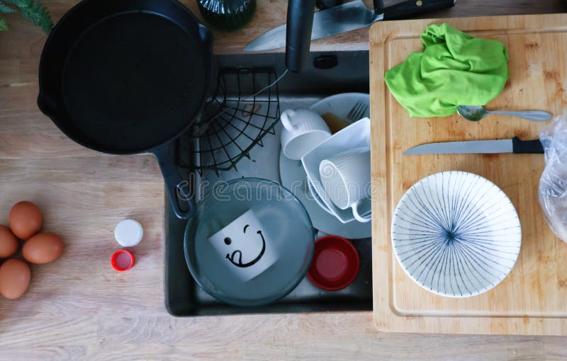 Kitchen Mess. a Top-down View of a Kitchen Sink Filled with Dirty ...