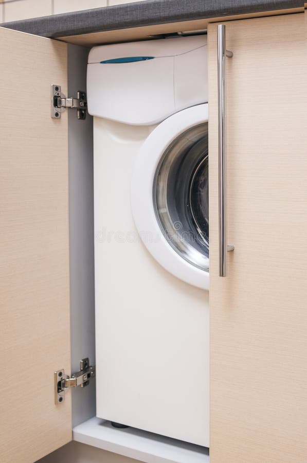 Kitchen Mini Cabinet with Portrable Washing Machine Inside Stock Image ...