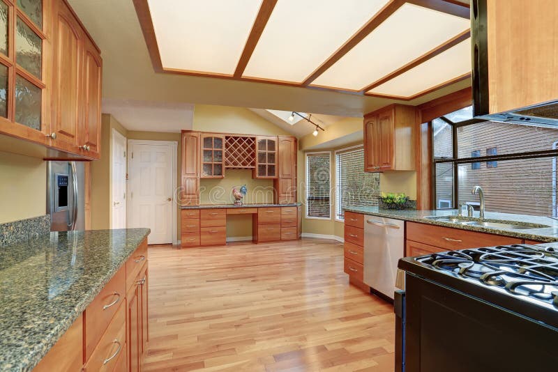 Kitchen with Nice Counters and Stained Cabinets. Stock Photo - Image of ...