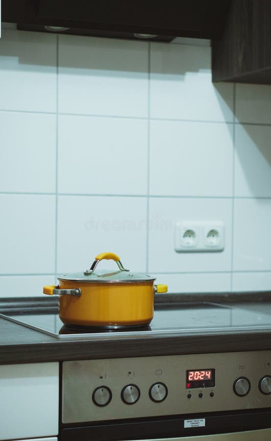 In the kitchen stock image. Image of orange, cooker - 138590103