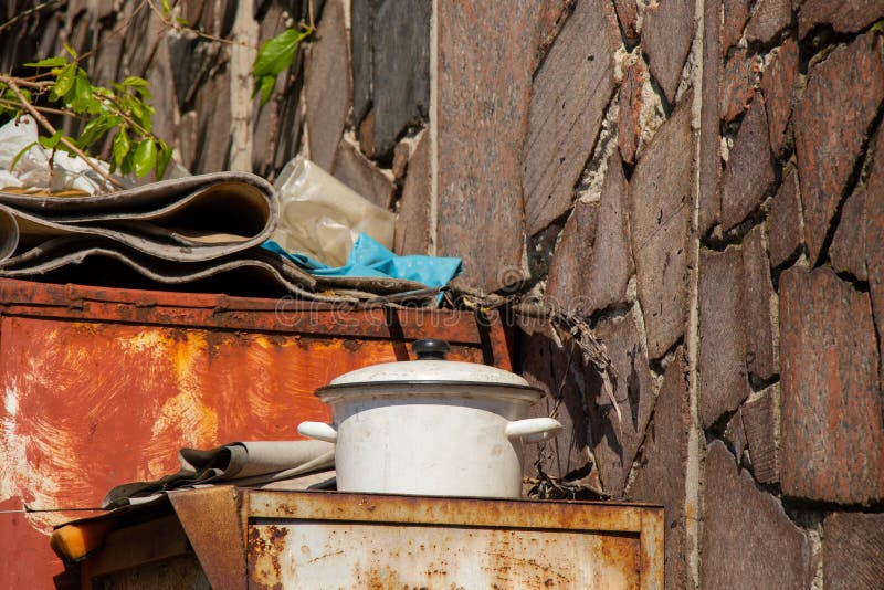White Kitchen Pot in a Garbage Dump on the Street Stock Photo - Image ...