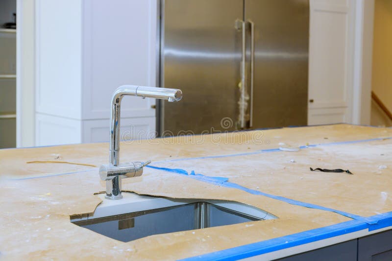 Kitchen Renovation with a Newly Installed Sink and Countertop in a ...