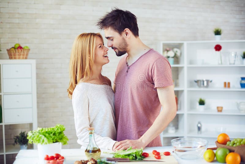 Kitchen Romance. Family Cooking in Kitchen. Couple in Love with Perfect ...