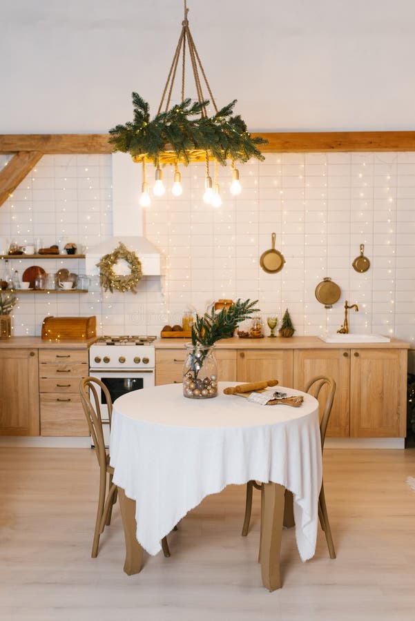 Kitchen with a Round Table and Chairs, a White Tablecloth and a ...