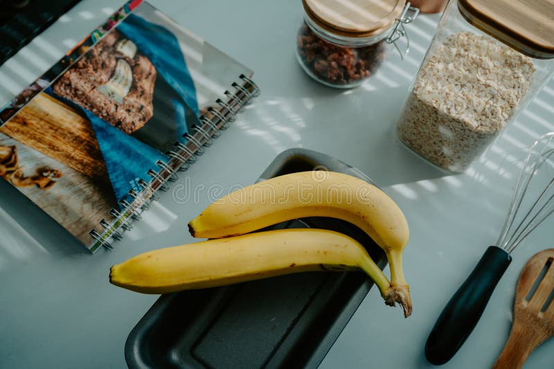 Kitchen Setup with Banana Bread and a Ripe Banana, Illuminated by ...