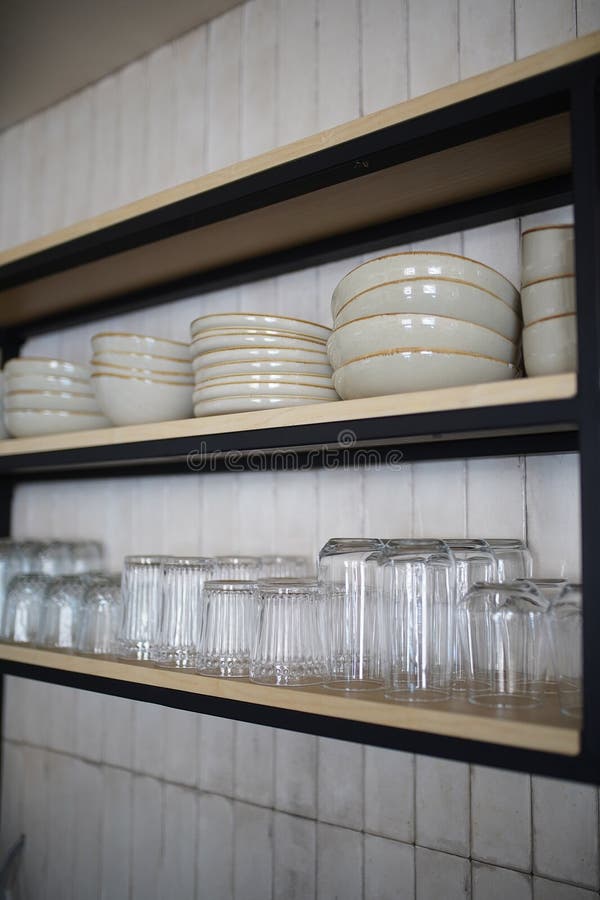 Kitchen Shelves with Various Ceramic Plates and Glass Cups Stock Photo ...